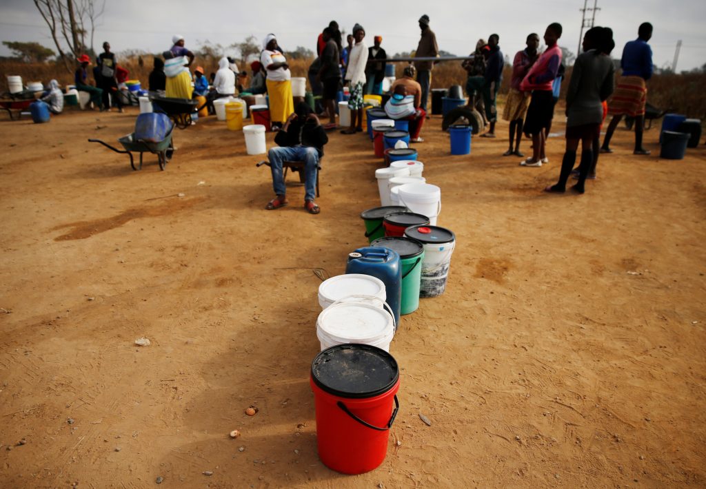 Families trek to unsafe wells as taps run dry in drought-hit Zimbabwe ...