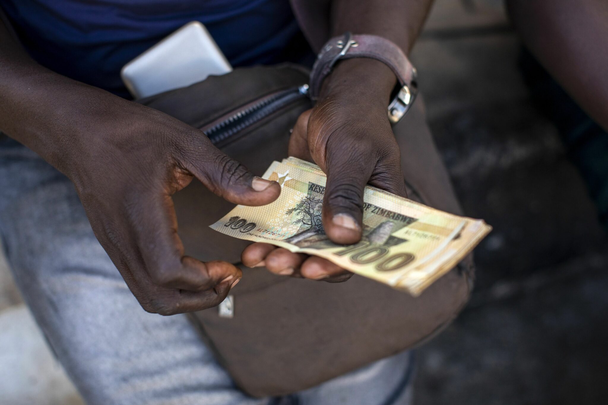 Zimbabwe replaces battered dollar with new gold-backed currency called ...